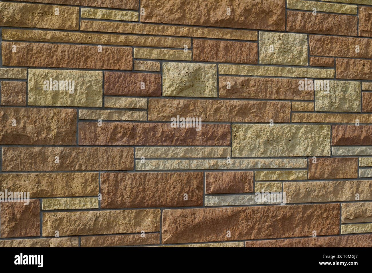 Beautiful modern limestone brick wall background in varying shades of ...