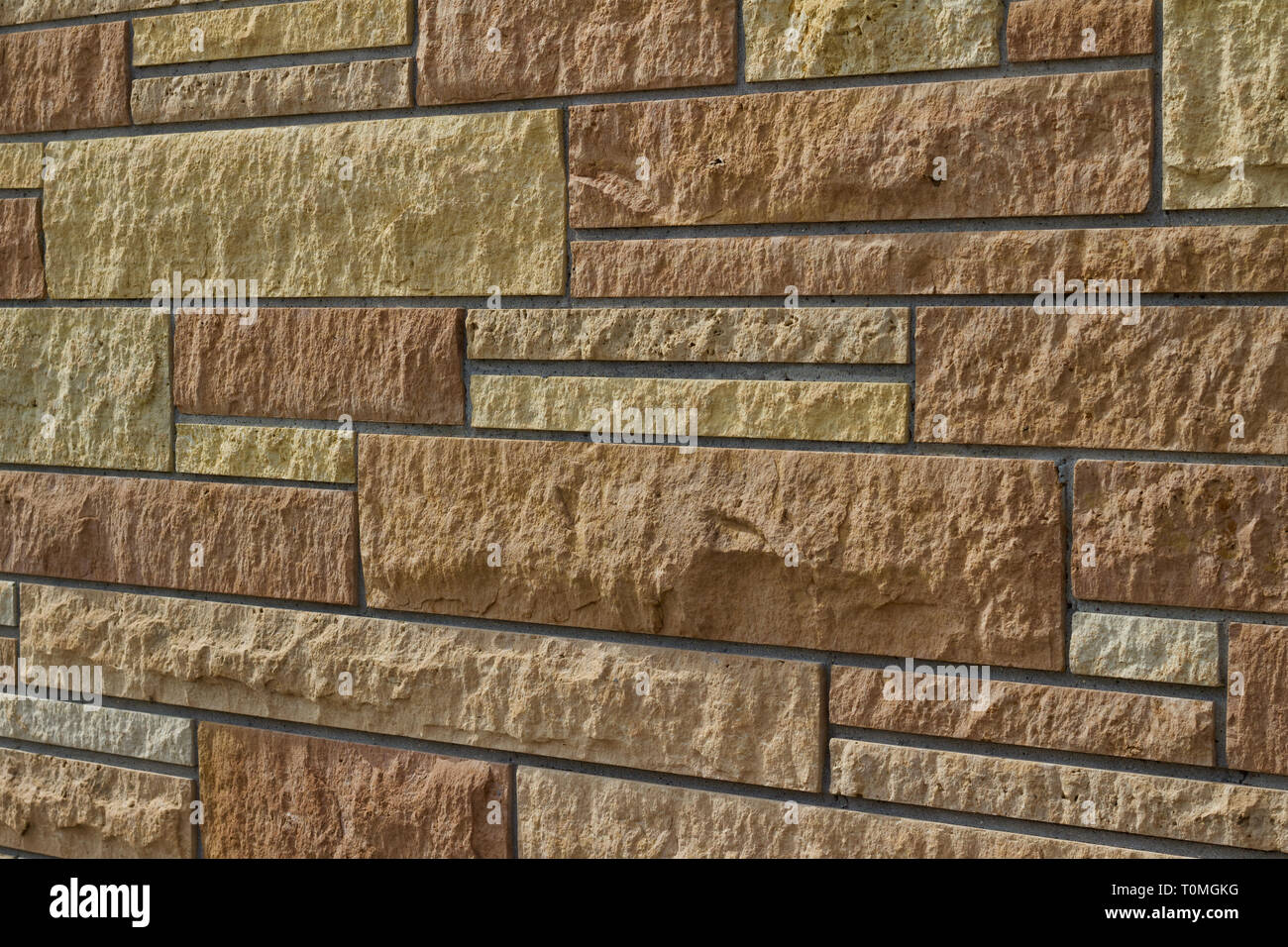 Beautiful modern limestone brick wall background in varying shades of ...