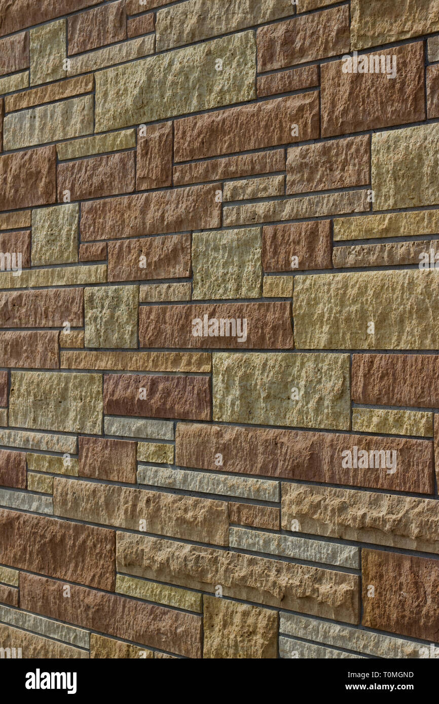 Beautiful modern limestone brick wall background in varying shades of ...