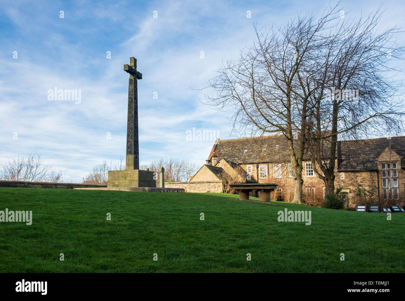Grave stone and cross in the yard of the medieval Durham Cathedral, UK ...