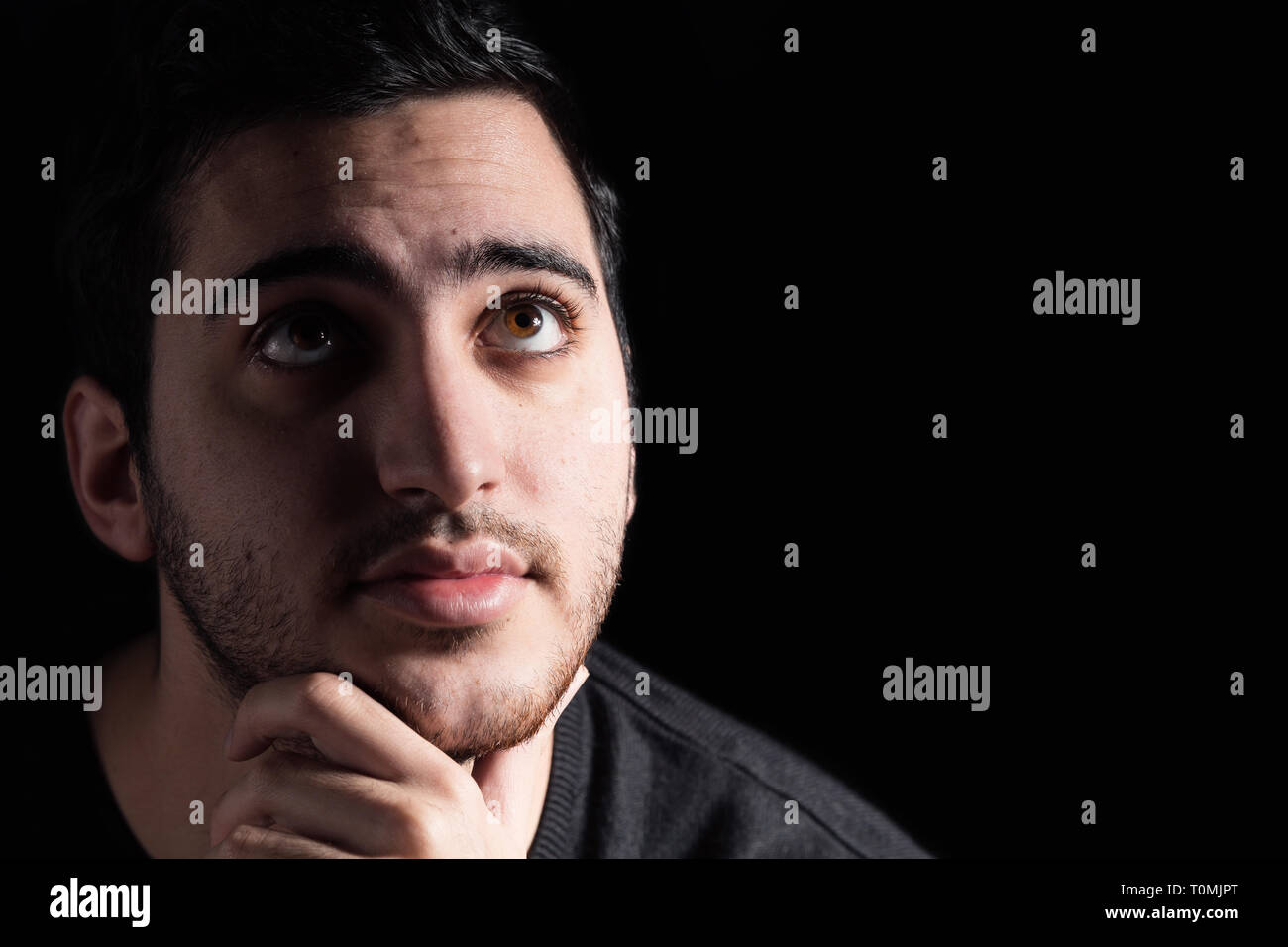 Young man pondering in hi-res stock photography and images - Alamy