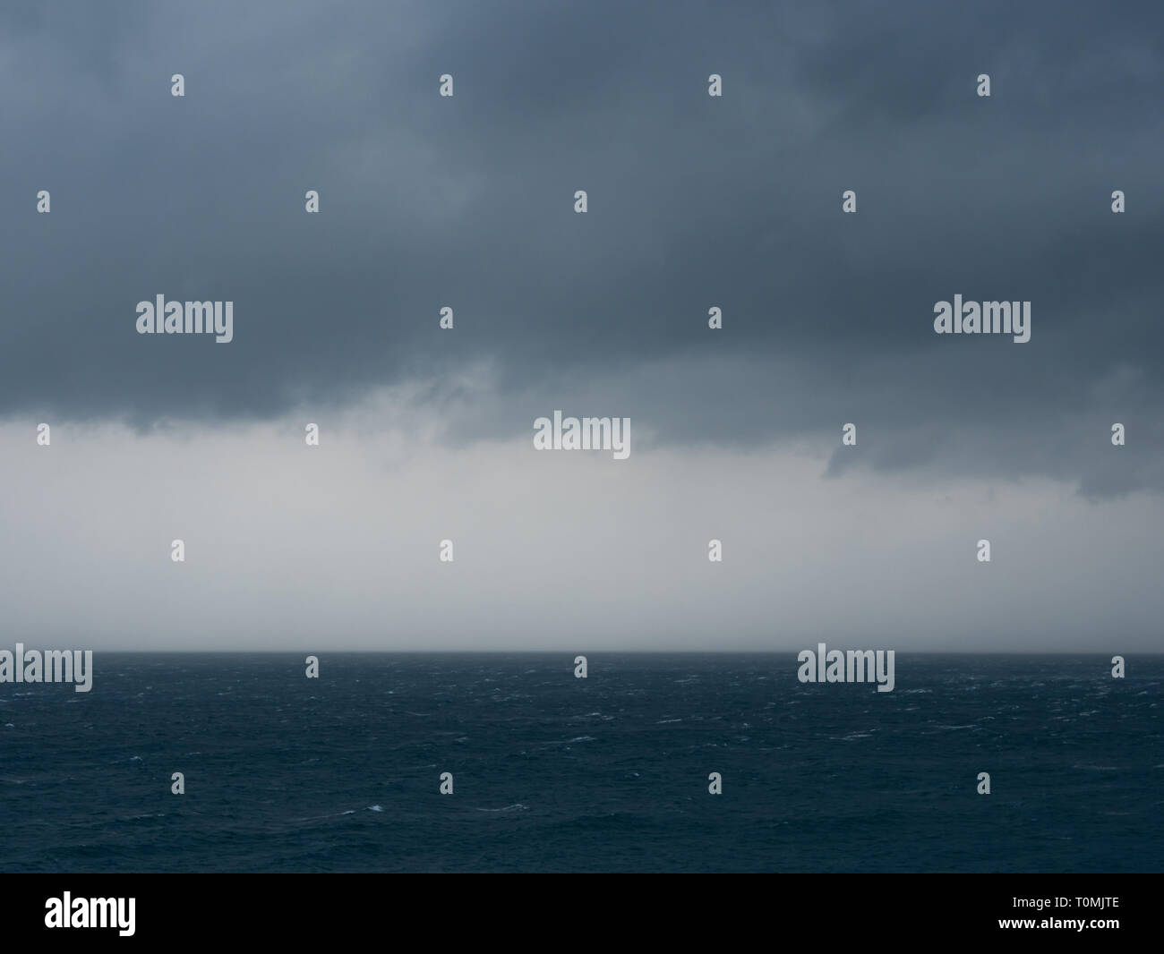 Rough weather on blue sea with stormy clouds Stock Photo - Alamy