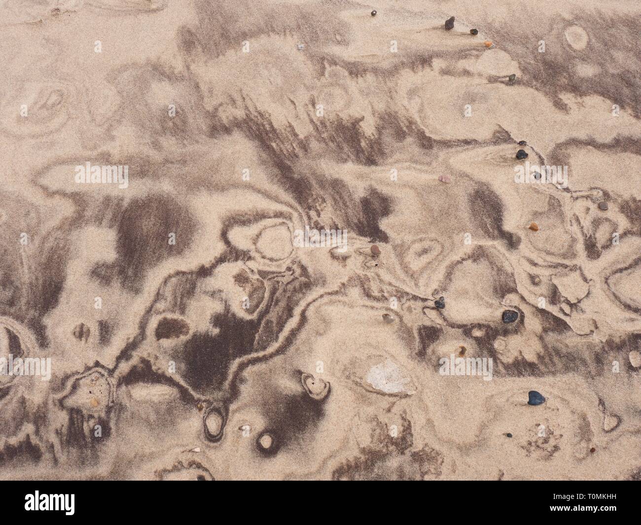 Desert sand pattern with beautiful shapes from crushed shells and ...