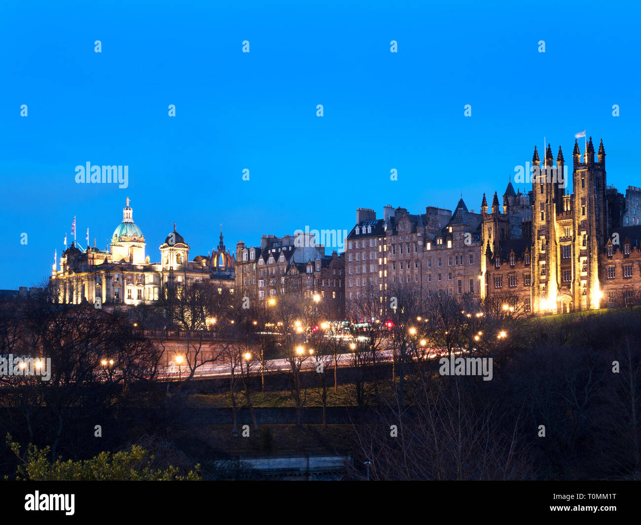 Floodlit buildings in the Old Town from Princes Street Gardens at dusk ...
