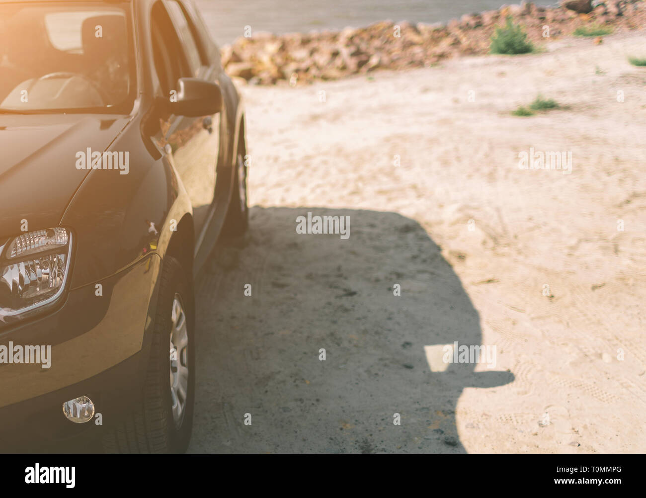 Car driving across ocean by the road. auto park on beach Stock Photo ...