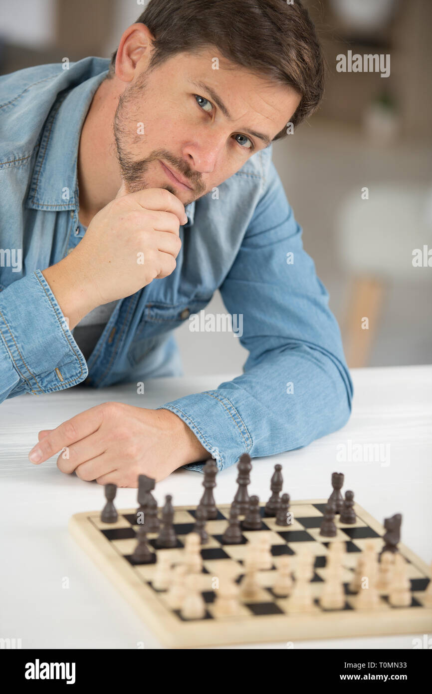 man thinking how to play chess Stock Photo - Alamy