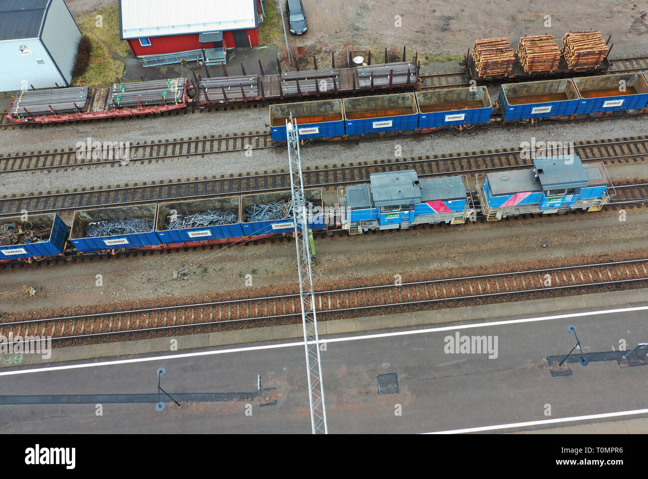 Sweden, Aerial view over a trainstation. Train from Ovako steel whith ...