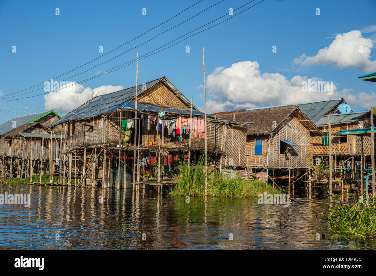 Wooden houses on the water on stilts, a fishing village on Inle Lake ...