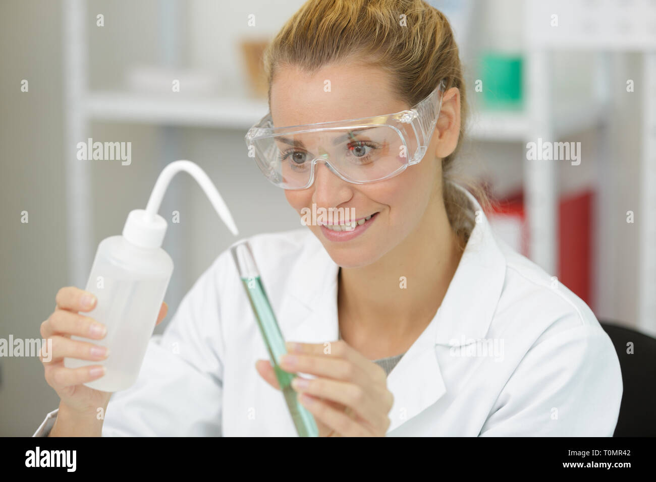 female biologist chemist doing laboratory experiments Stock Photo - Alamy