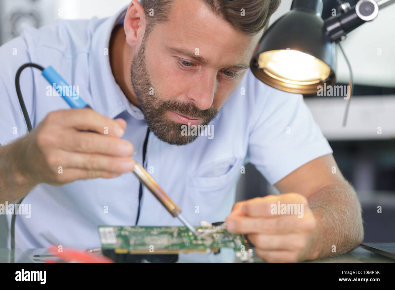 engineer working on circuit board Stock Photo - Alamy