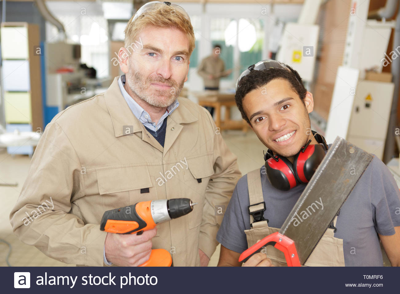 engineer teaching apprentices with machines Stock Photo - Alamy