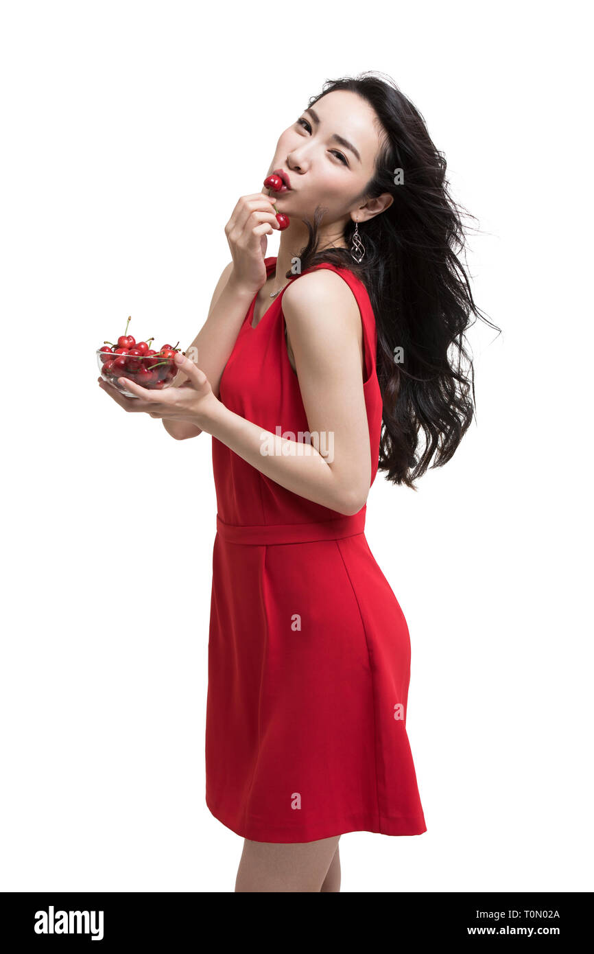 Woman eating cherries hi-res stock photography and images - Alamy