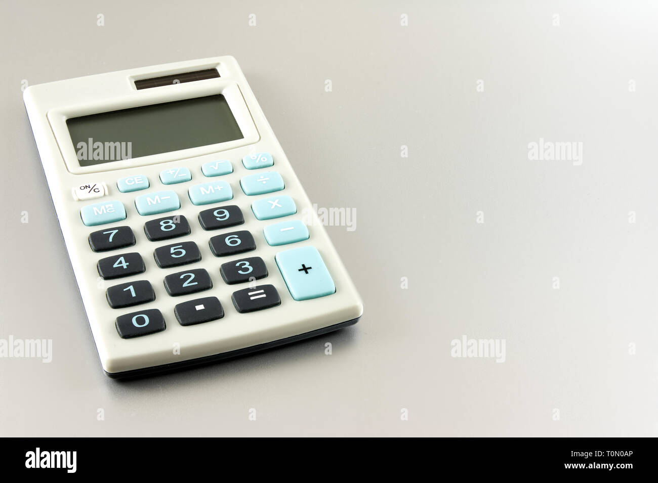 Colored simple calculator on white background Stock Photo - Alamy