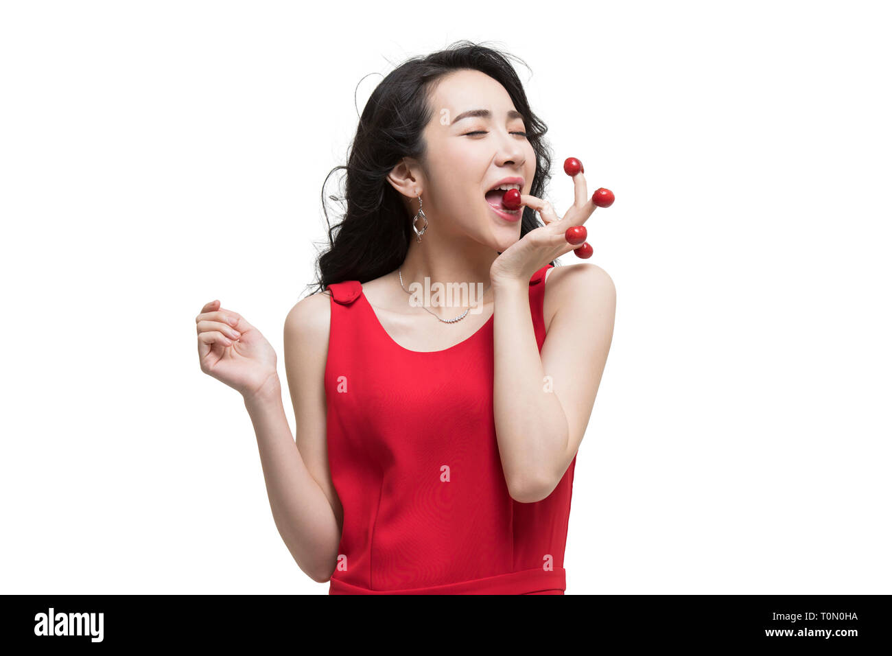 Woman eating cherries hi-res stock photography and images - Alamy