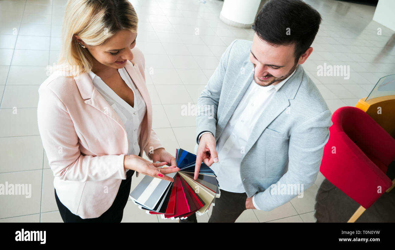 Beautiful female customer choosing new hi-res stock photography and ...