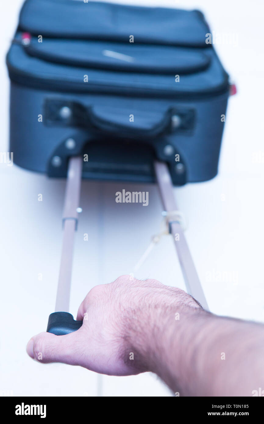 Pulling luggage hi-res stock photography and images - Alamy