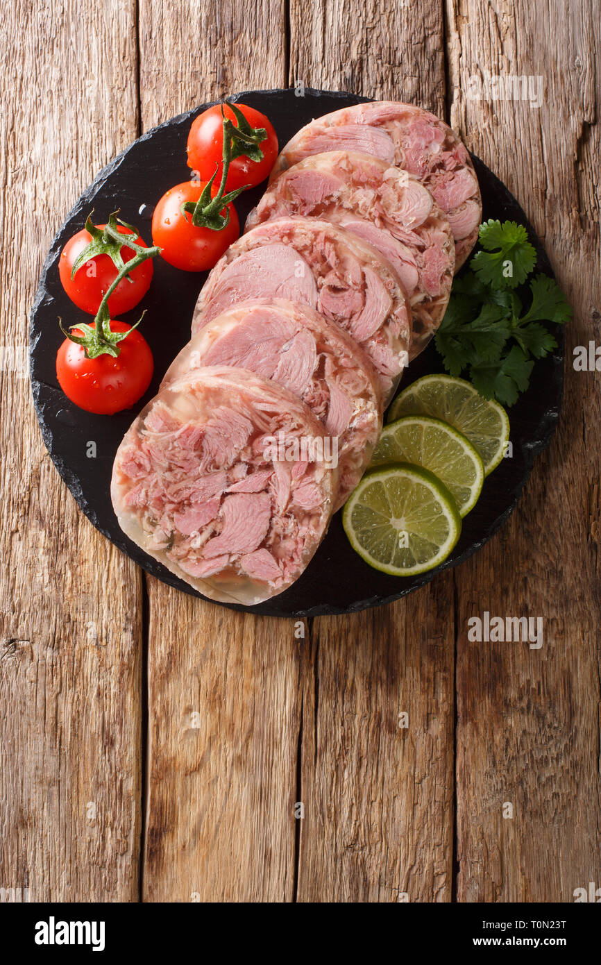Delicious sliced Head cheese or brawn served with tomatoes, lime and ...