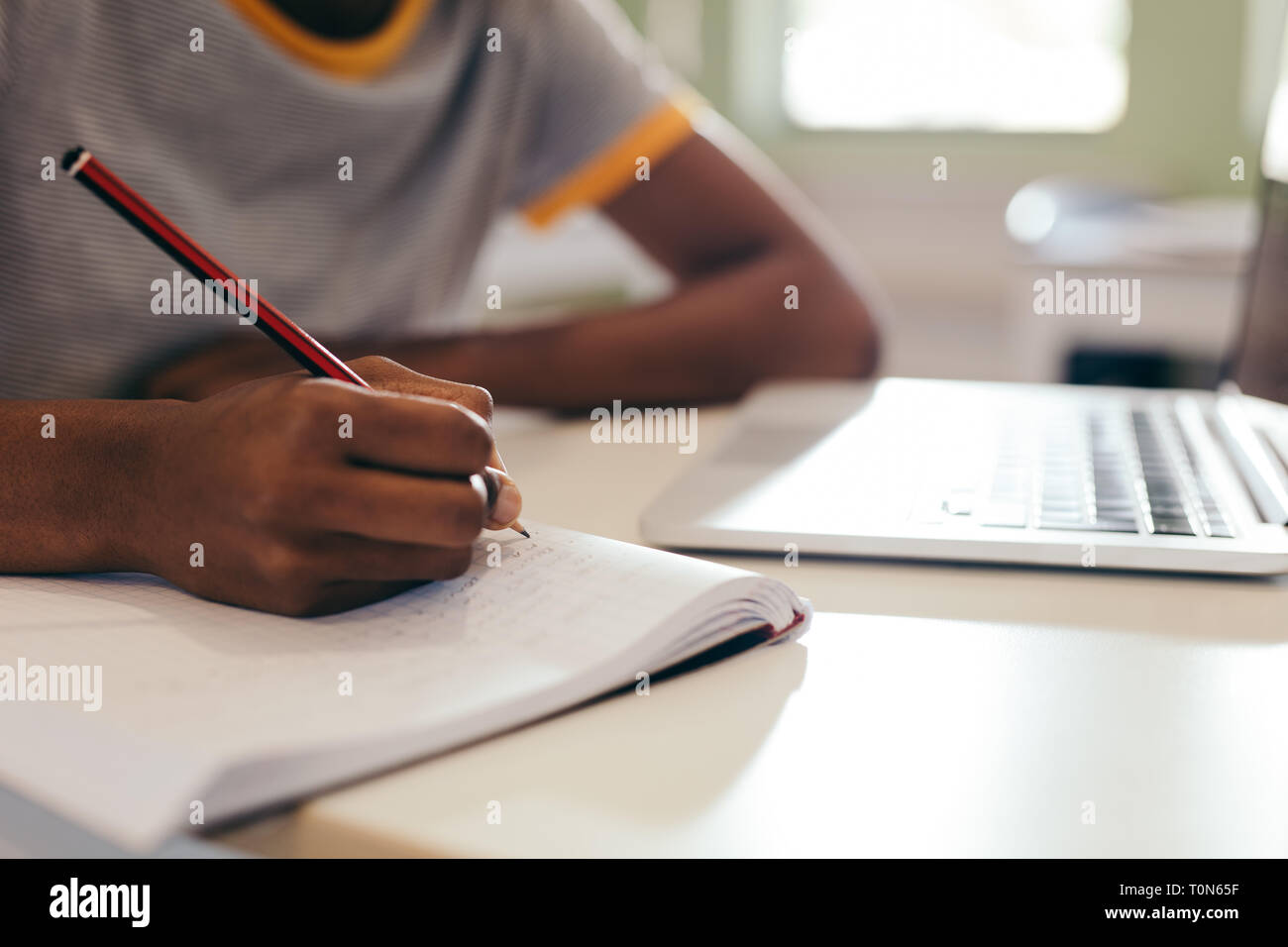 Close up of female student at lecture in classroom. Focus on young ...