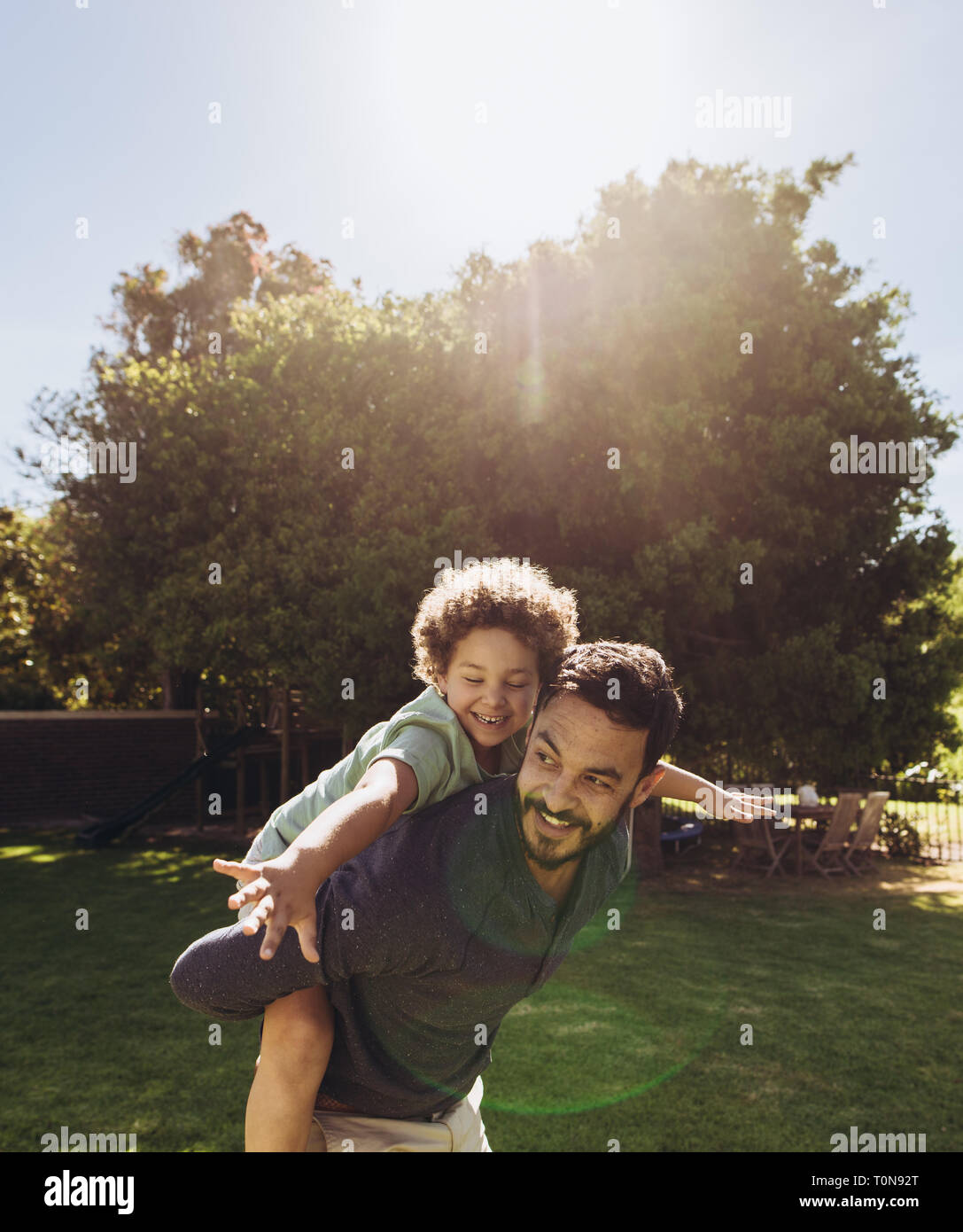 Father carrying child in arms hi-res stock photography and images - Alamy