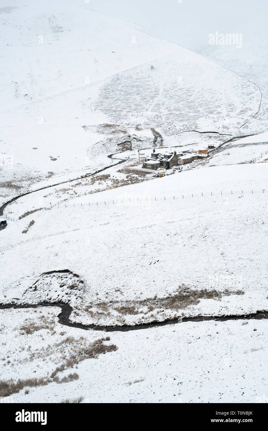 Farmhouse in the snow covered Dalveen Pass in the Lowther Hills ...