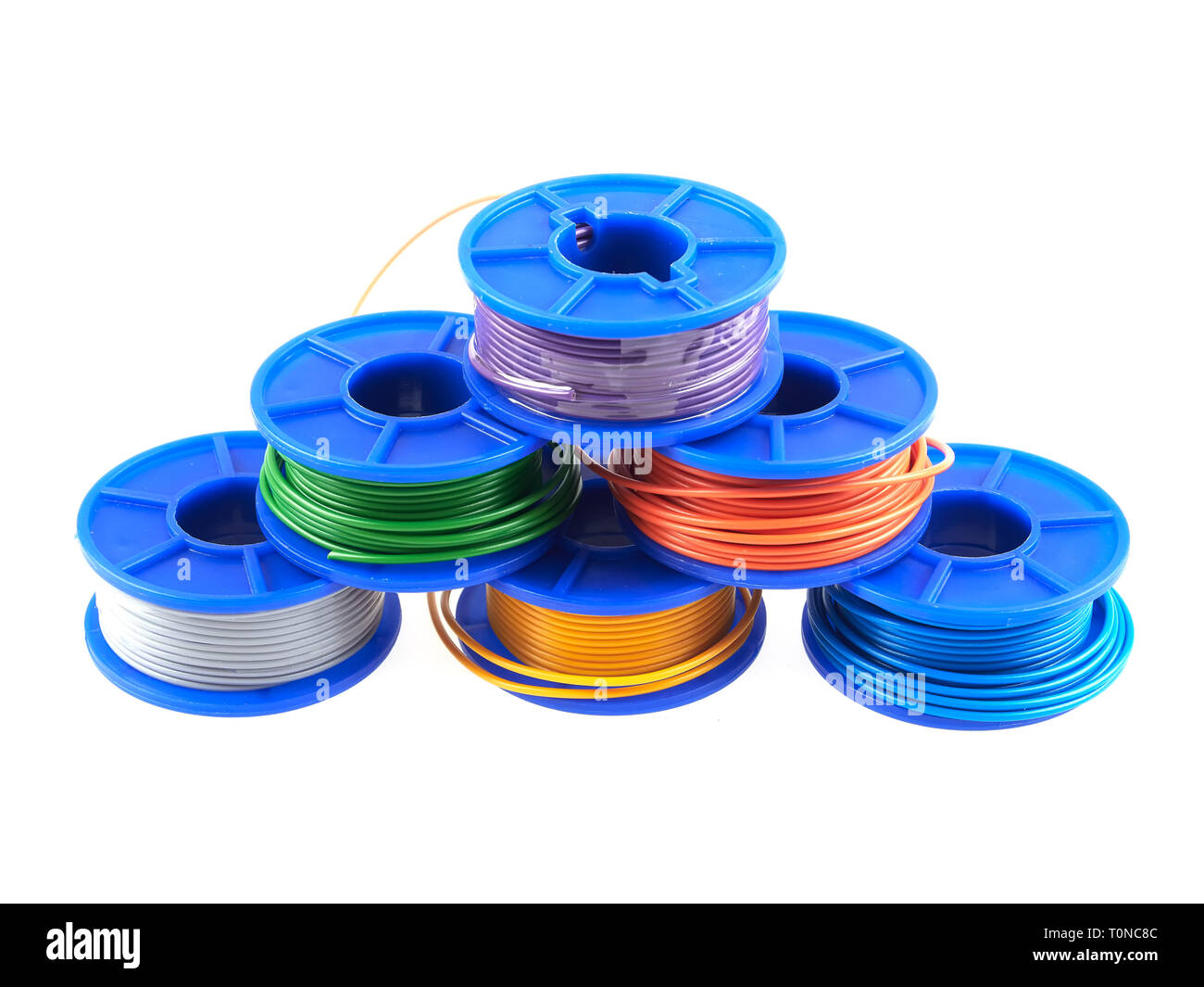A group of plastic spools with colorful electric cables, isolated on ...