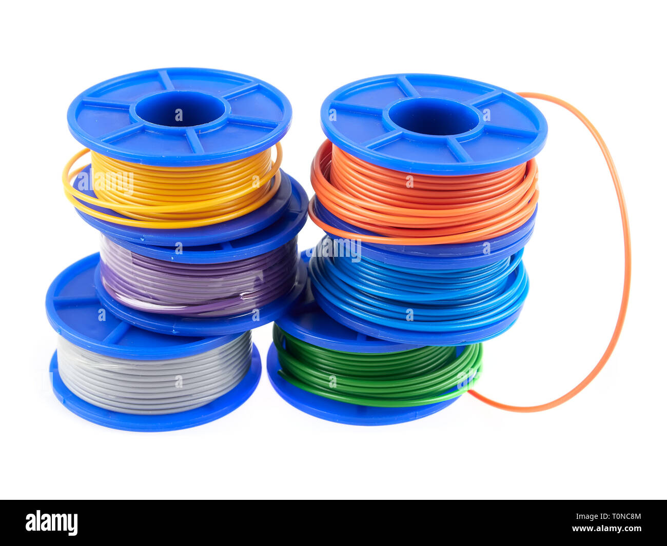 A group of plastic spools with color electric cables, isolated on white ...