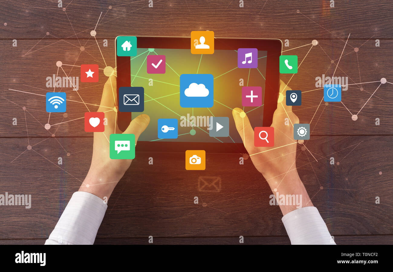Hand touching multitask tablet with cloud wifi message social media ...