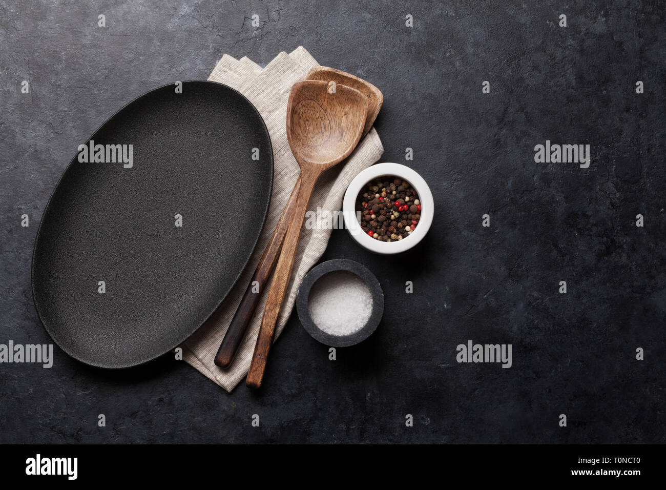Cooking wooden utensils, empty plate and spices. Food cooking template ...