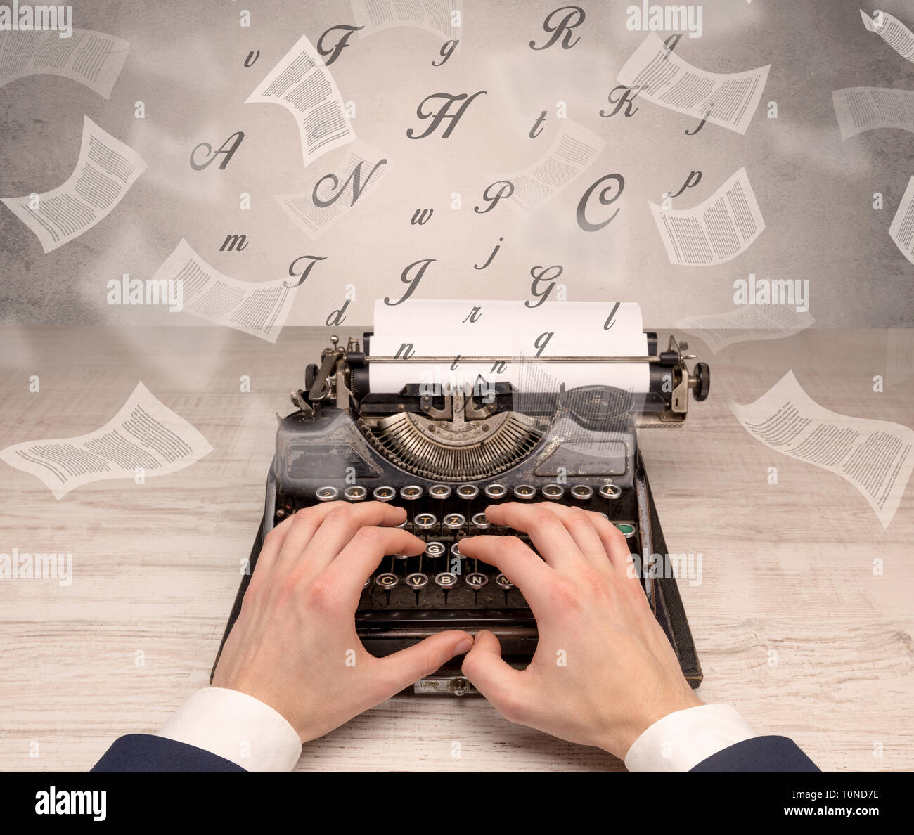 First person perspective hand typewriting with flying documents around ...