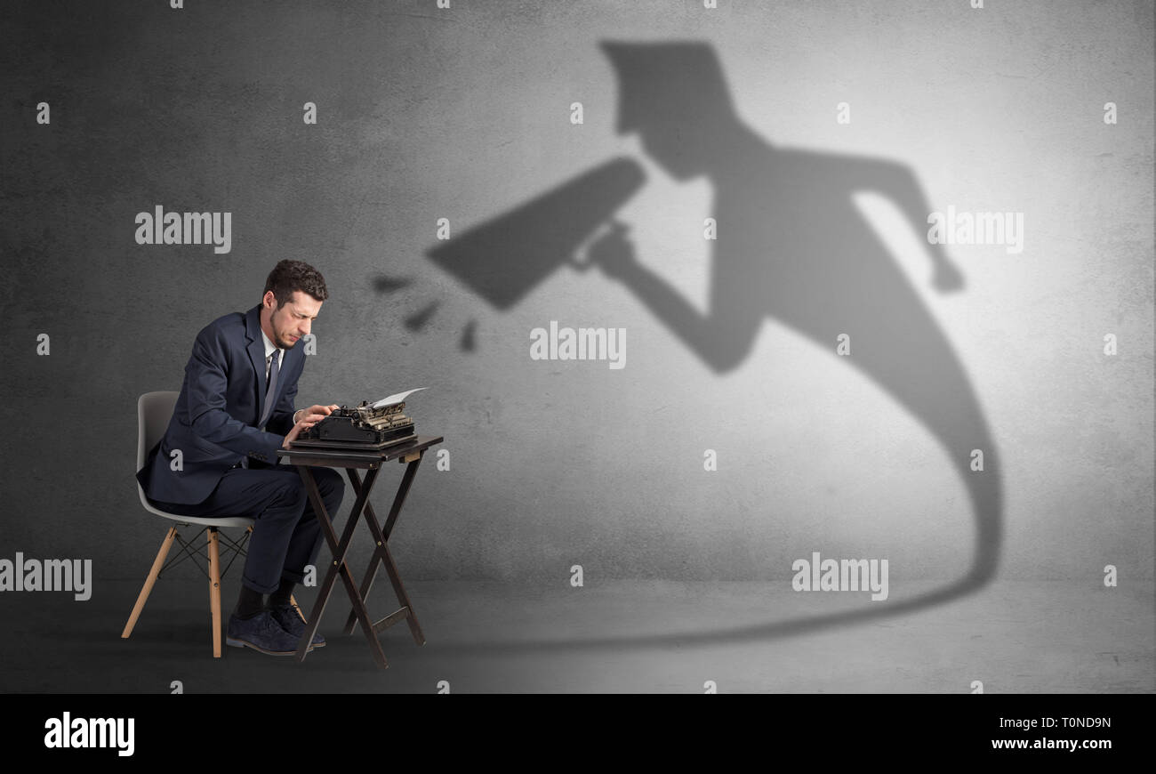 Hard working businessman shadow yelling to himself concept Stock Photo ...