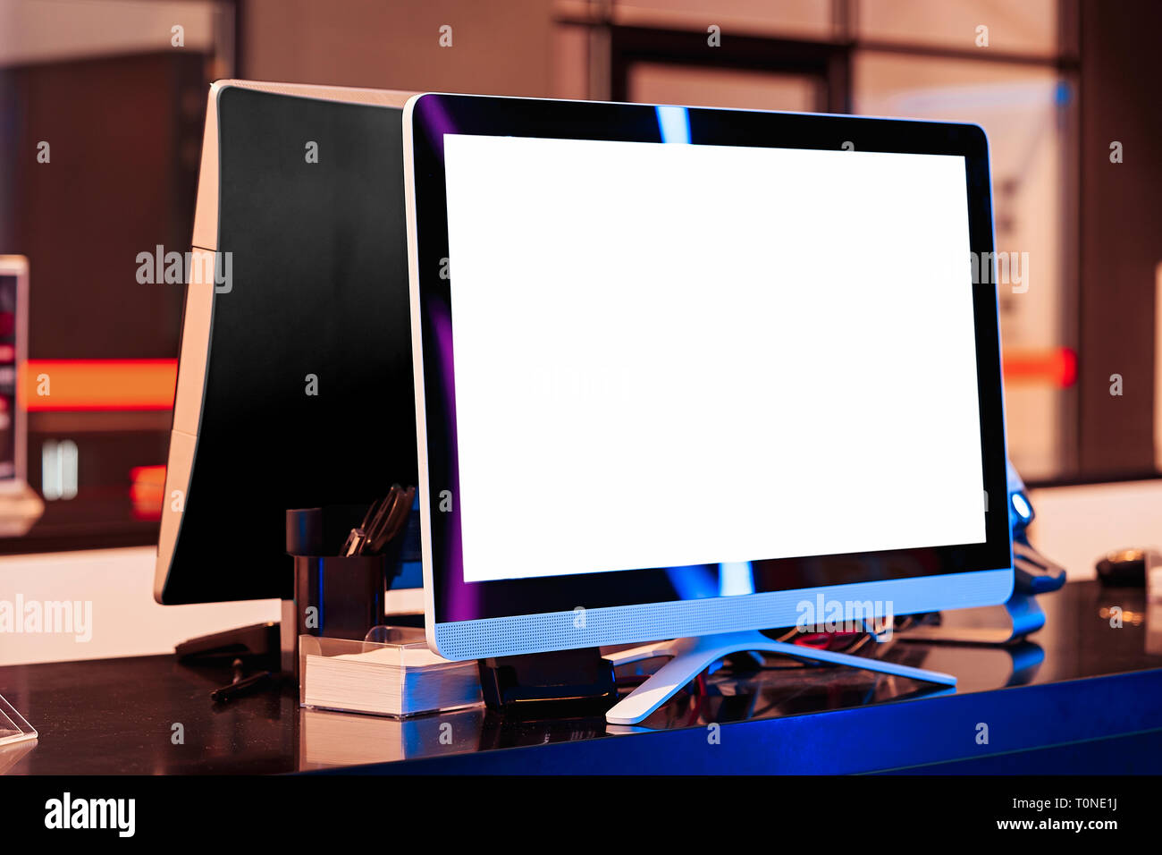 Blank white monitors with empty space at the entrance in modern gym ...