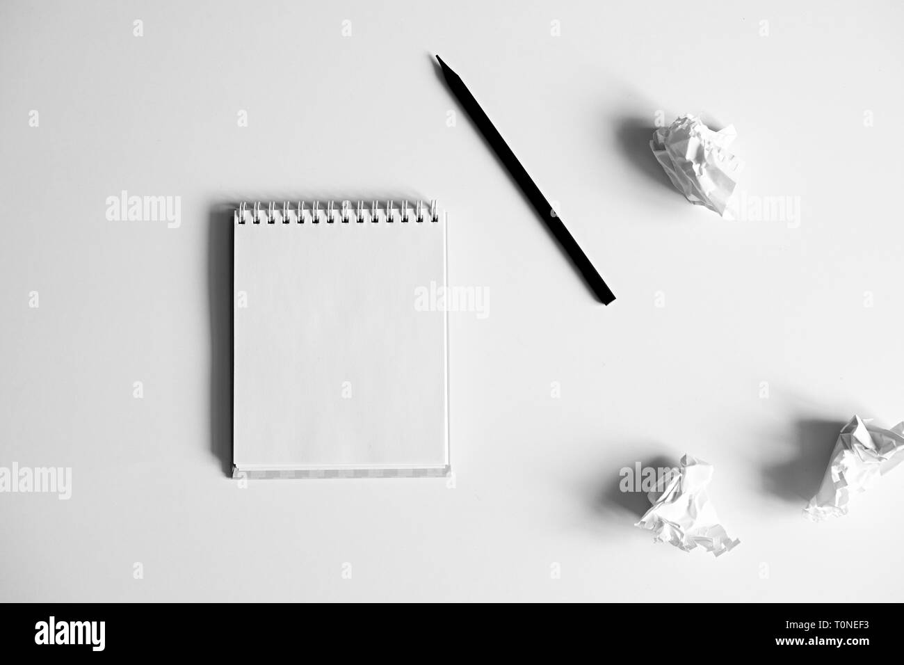 Flat lay of blank white notepad, pencil and crumpled paper on white ...