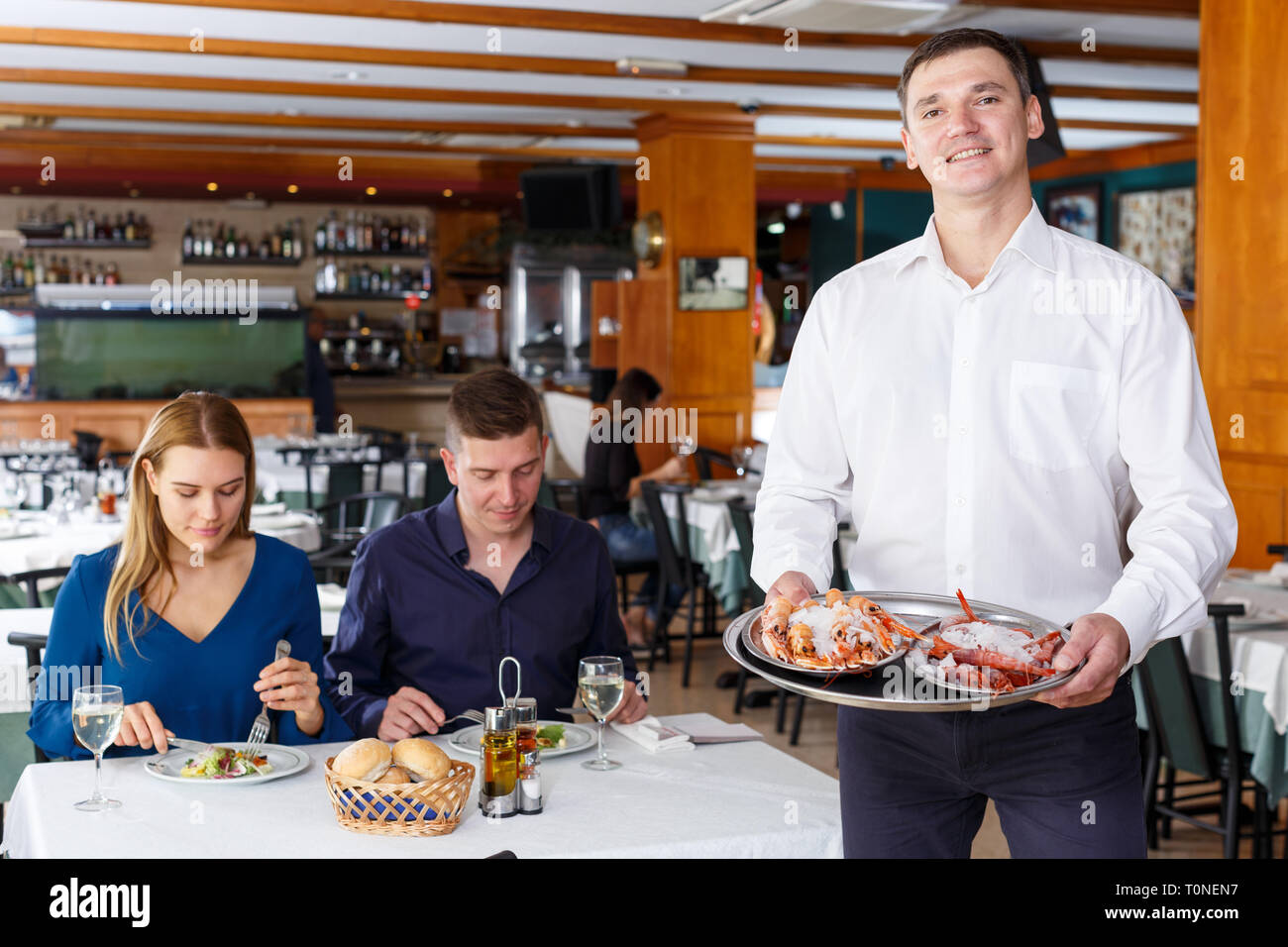 Handsome waiter menu on hi-res stock photography and images - Alamy
