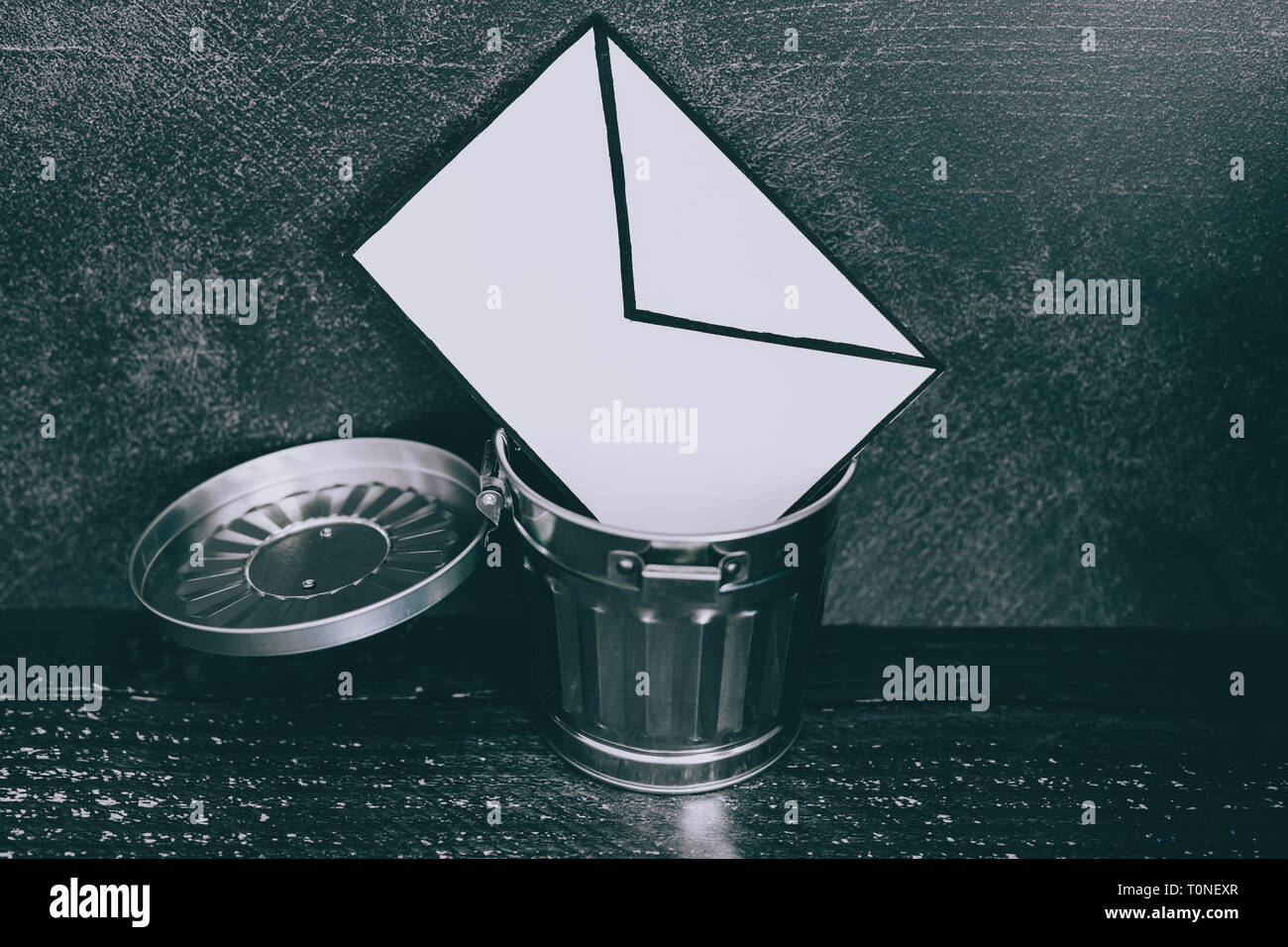 junk email envelope going in the trash, concept of getting rid of spam ...