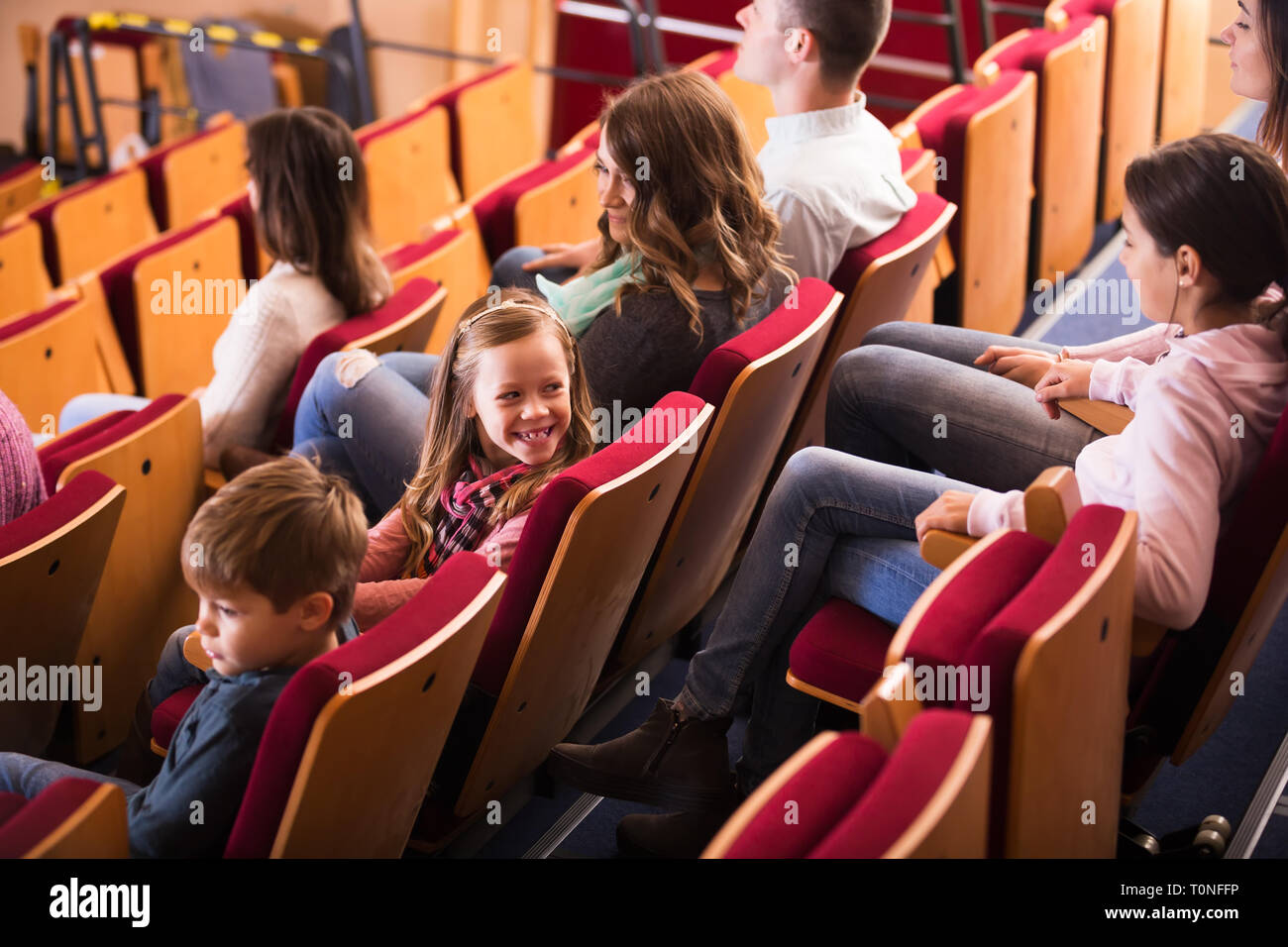 Child is distracted from screen during movie in cinema Stock Photo - Alamy