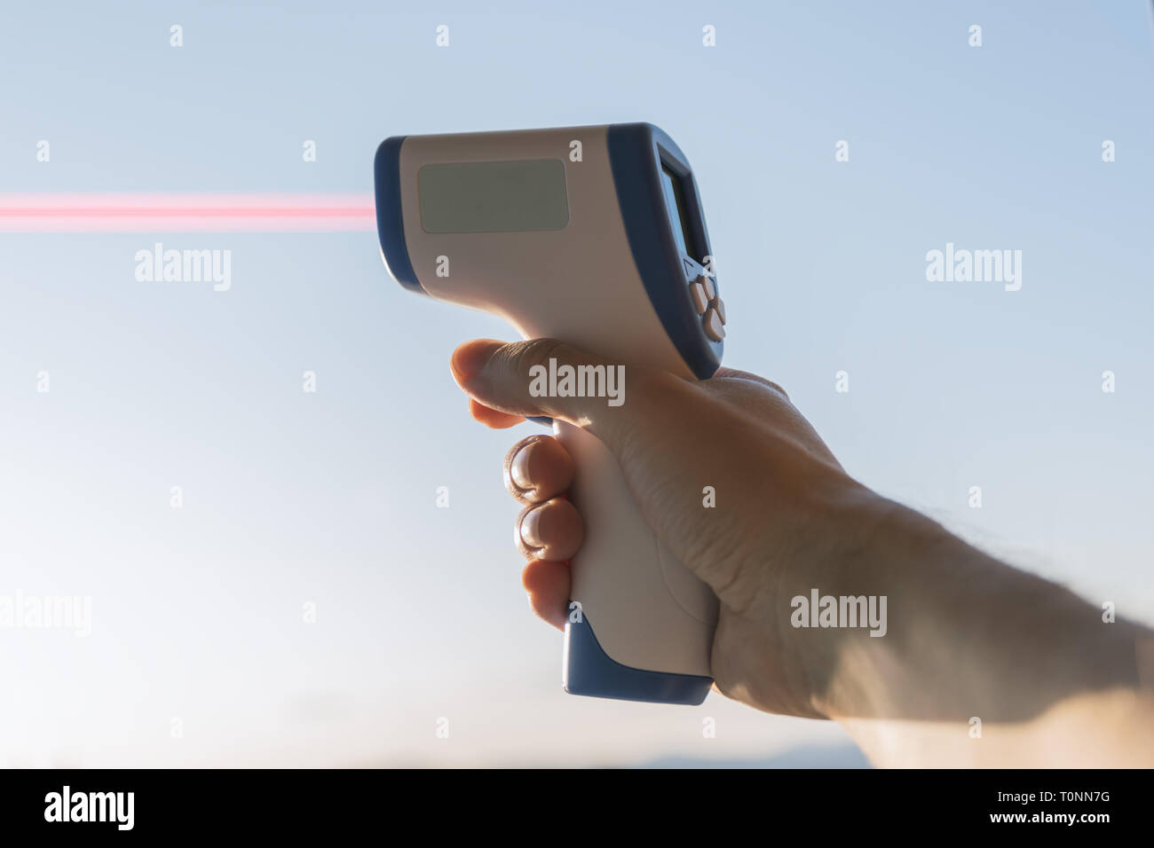 Laser rangefinder with laser beam Stock Photo - Alamy