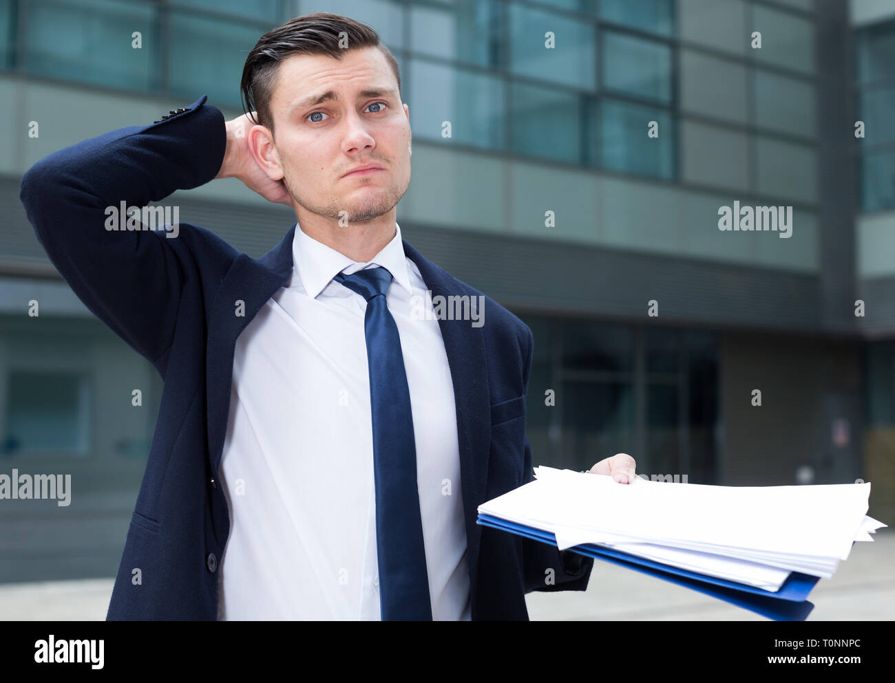 Desperated man is standing upset near office because of low financial ...