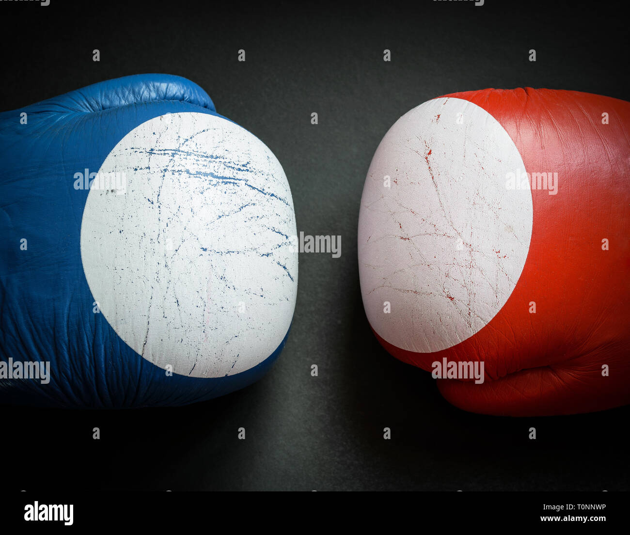 Old and used boxing gloves on dark background Stock Photo - Alamy