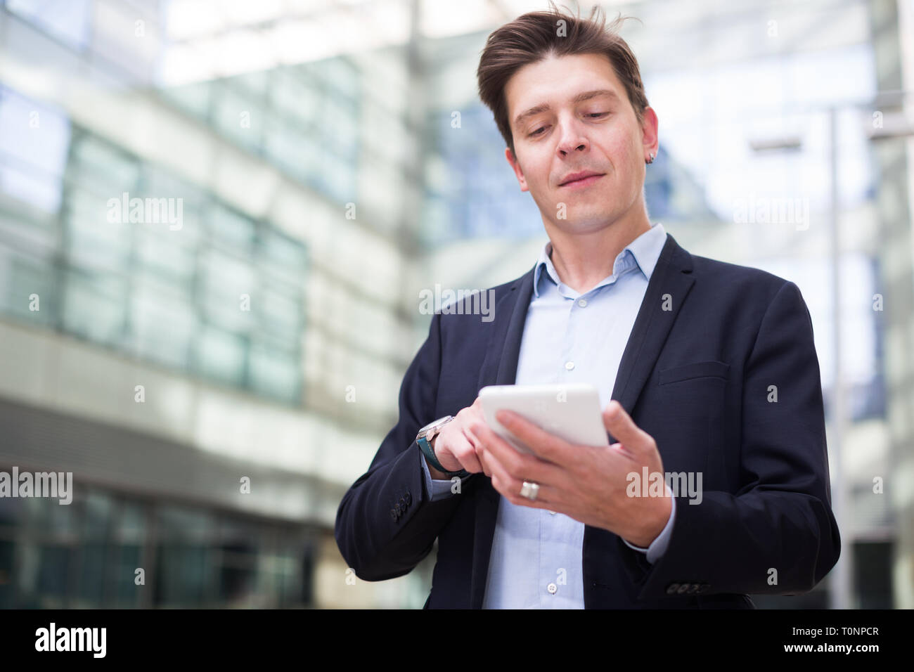 Male testing digital tablet and touchscreen in the big city Stock Photo ...