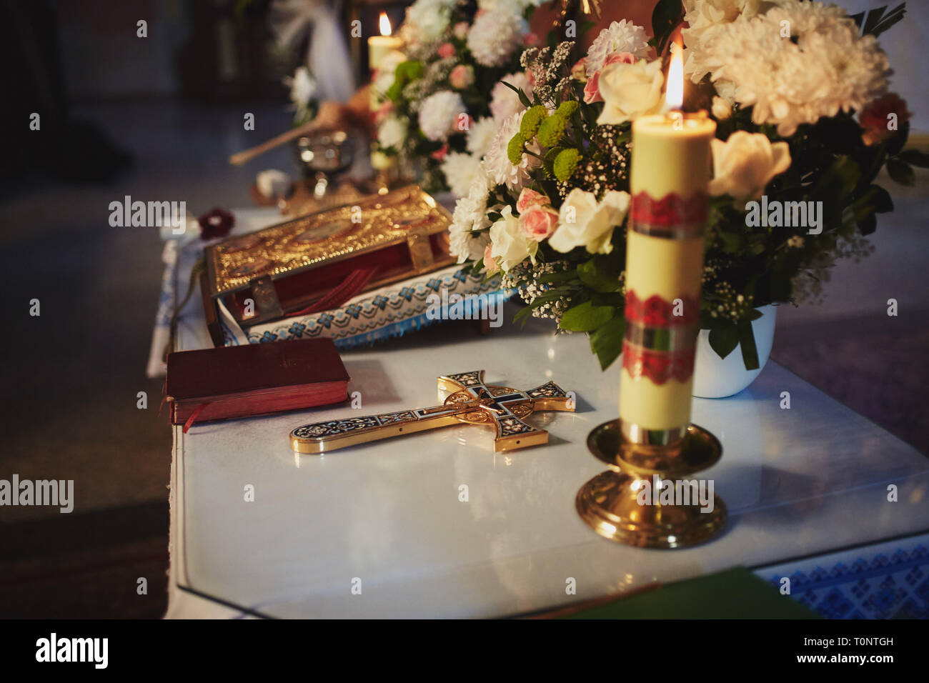 Church utensil, wedding crowns on an altar, cross and the Bible on ...