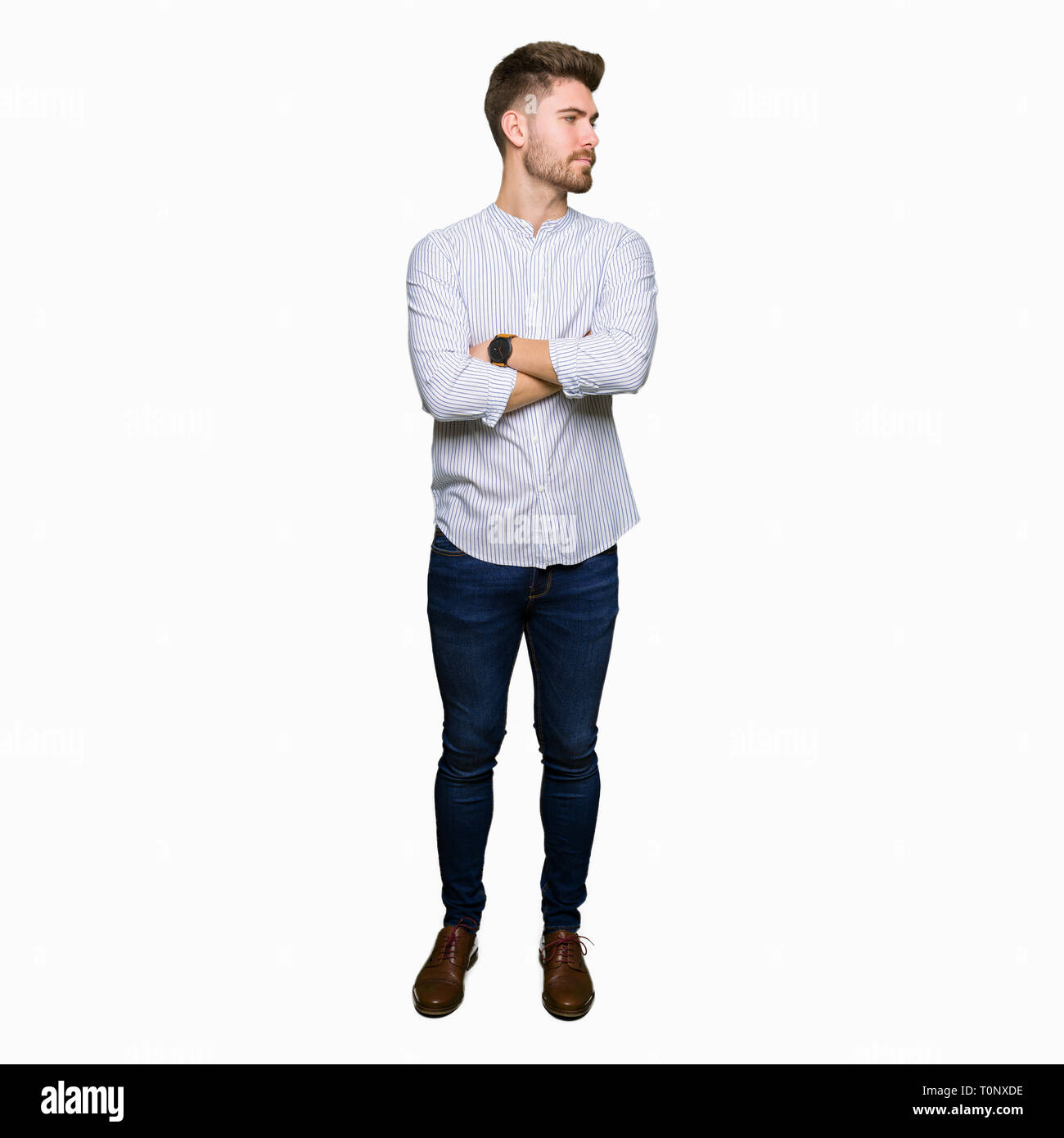 Young man arms folded side Cut Out Stock Images & Pictures - Alamy
