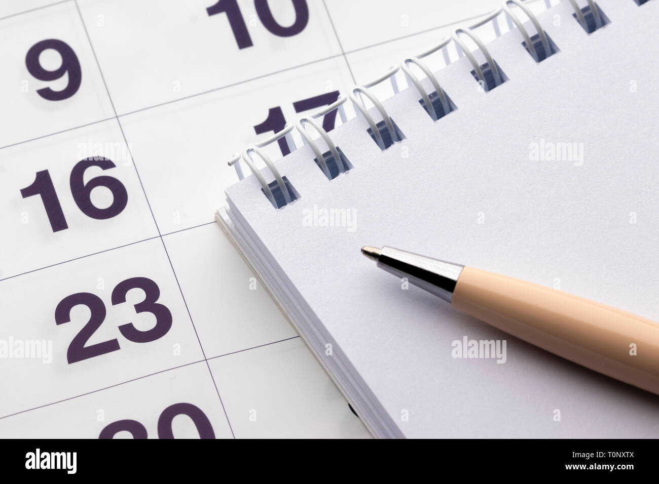 Notepad, calendar and ballpoint pen Stock Photo - Alamy