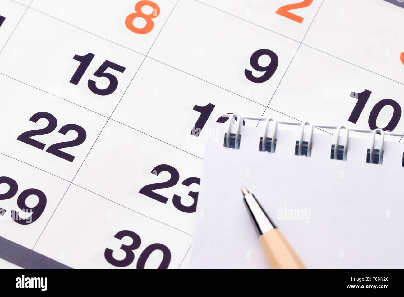 Business concept. Notepad, calendar and ballpoint pen Stock Photo - Alamy