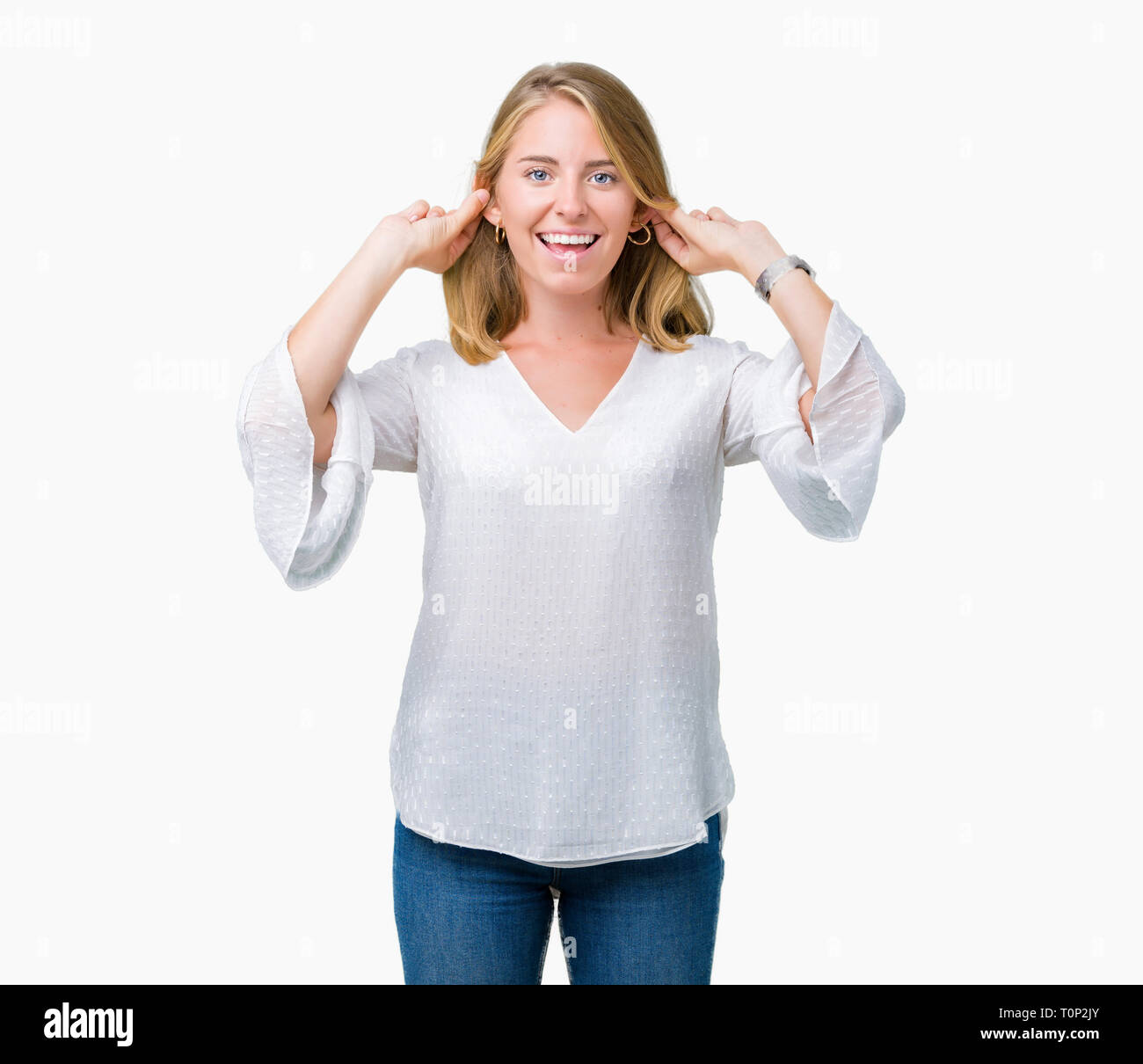 Beautiful young elegant woman over isolated background Smiling pulling ...