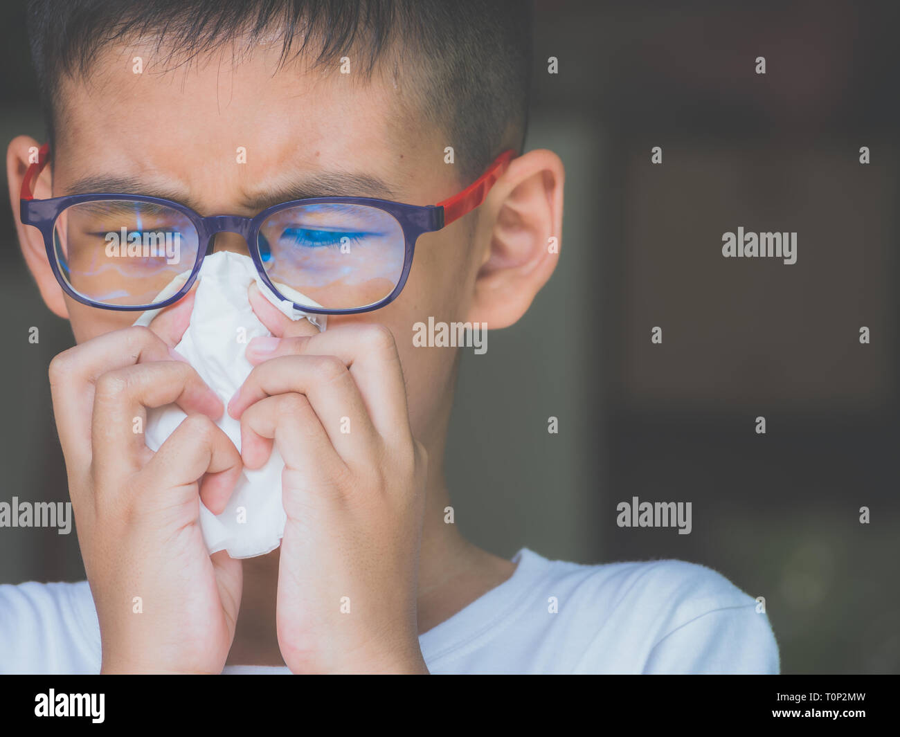 Boy get cold and blow runny nose with tissue. health concept Stock ...