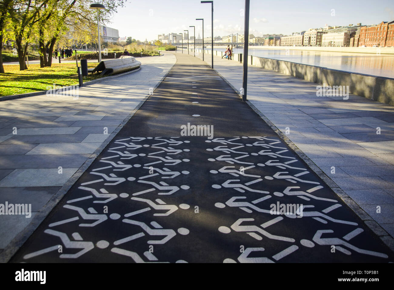 Pedestrian crossing sign on asphalt in city public park. The walking ...