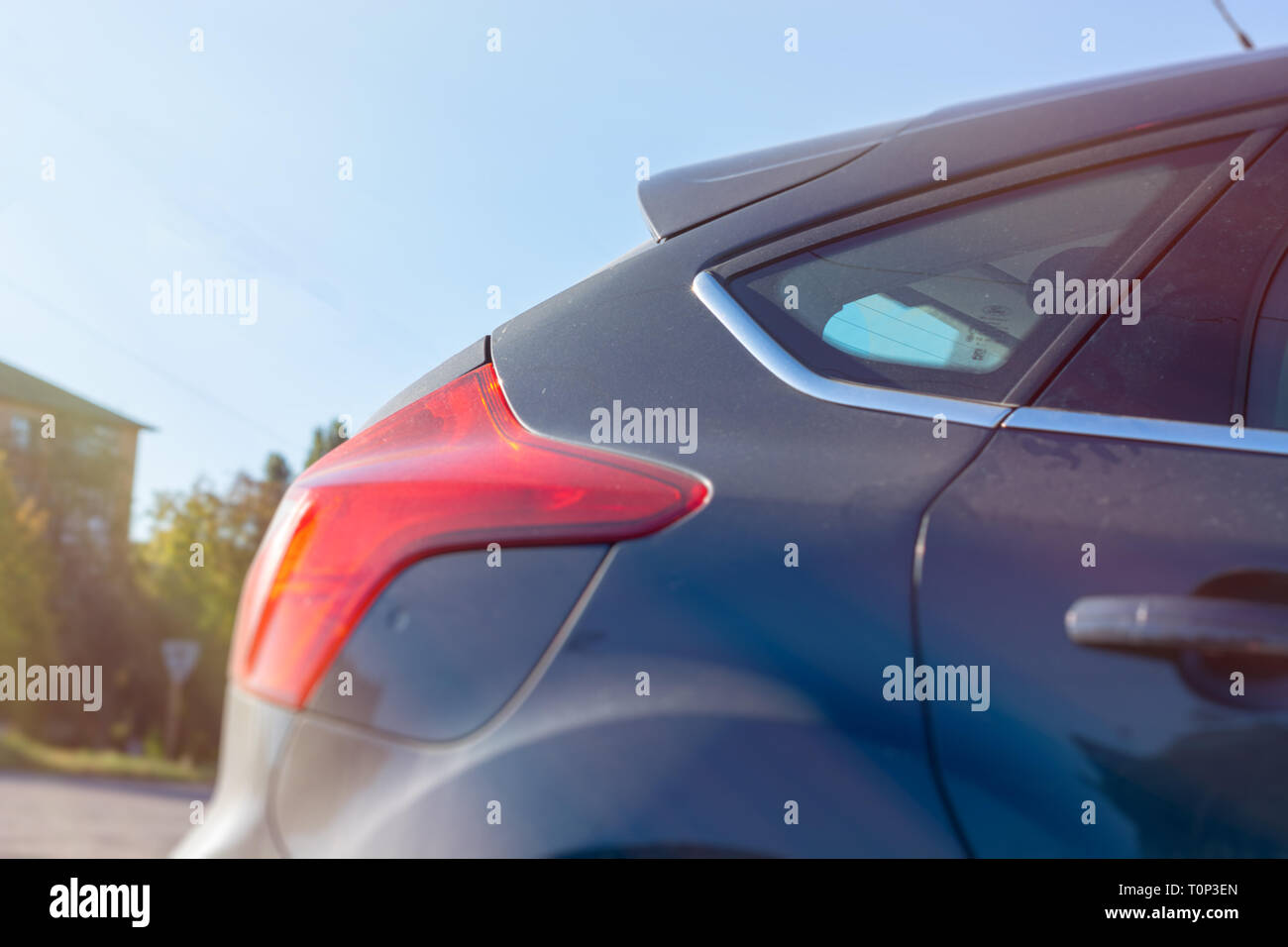 back blue car in the Sun during the day Stock Photo - Alamy