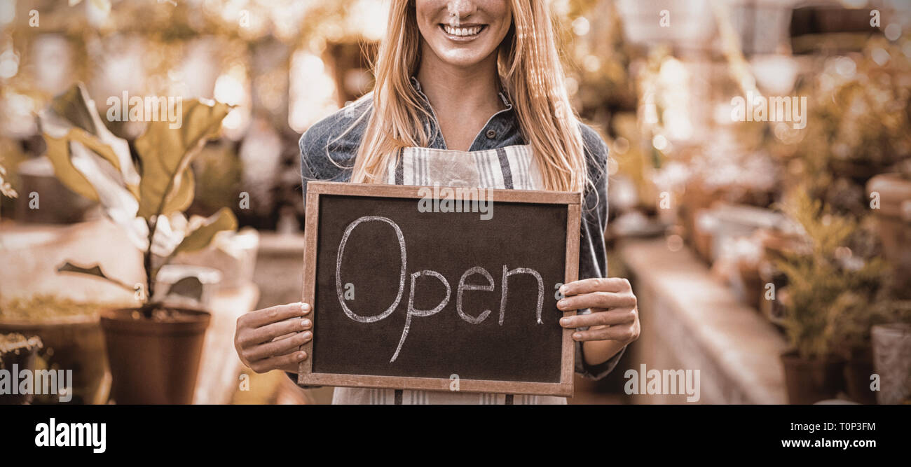 Holding placard sign hi-res stock photography and images - Alamy
