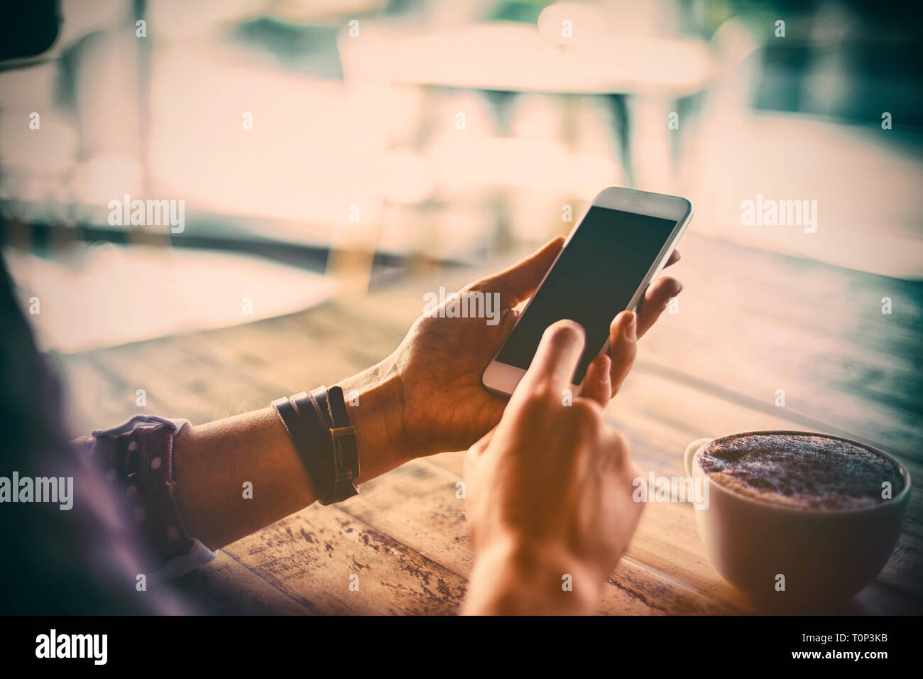 Business woman using mobile phone indoors Stock Photo - Alamy