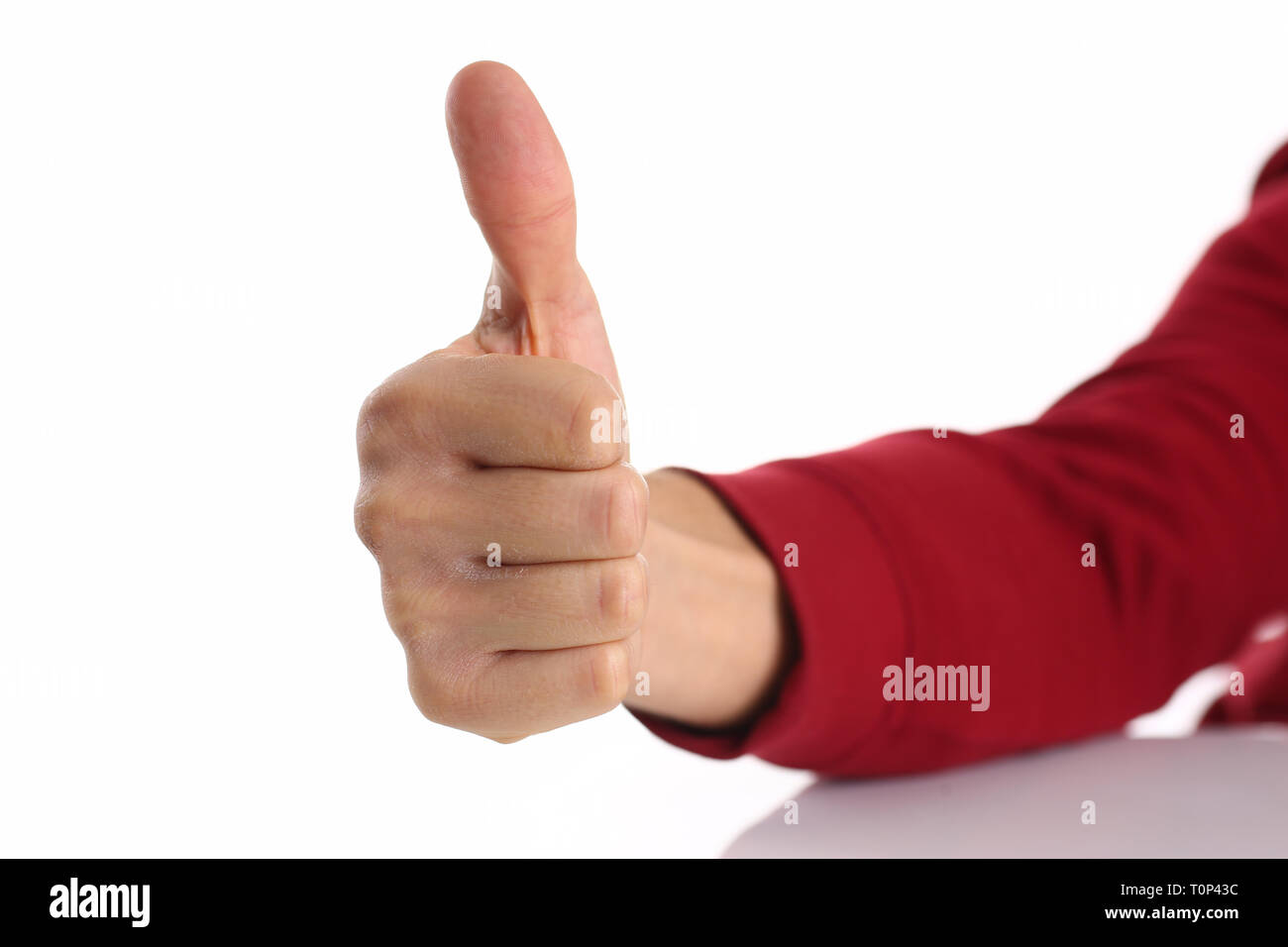 Male arm showing OK or confirm sign with thumb up Stock Photo - Alamy